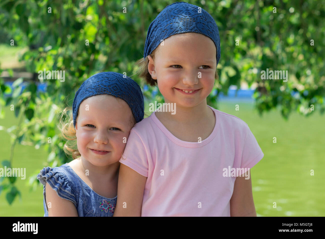 Cute funny little girls (sisters) smile, selective focus Stock Photo ...
