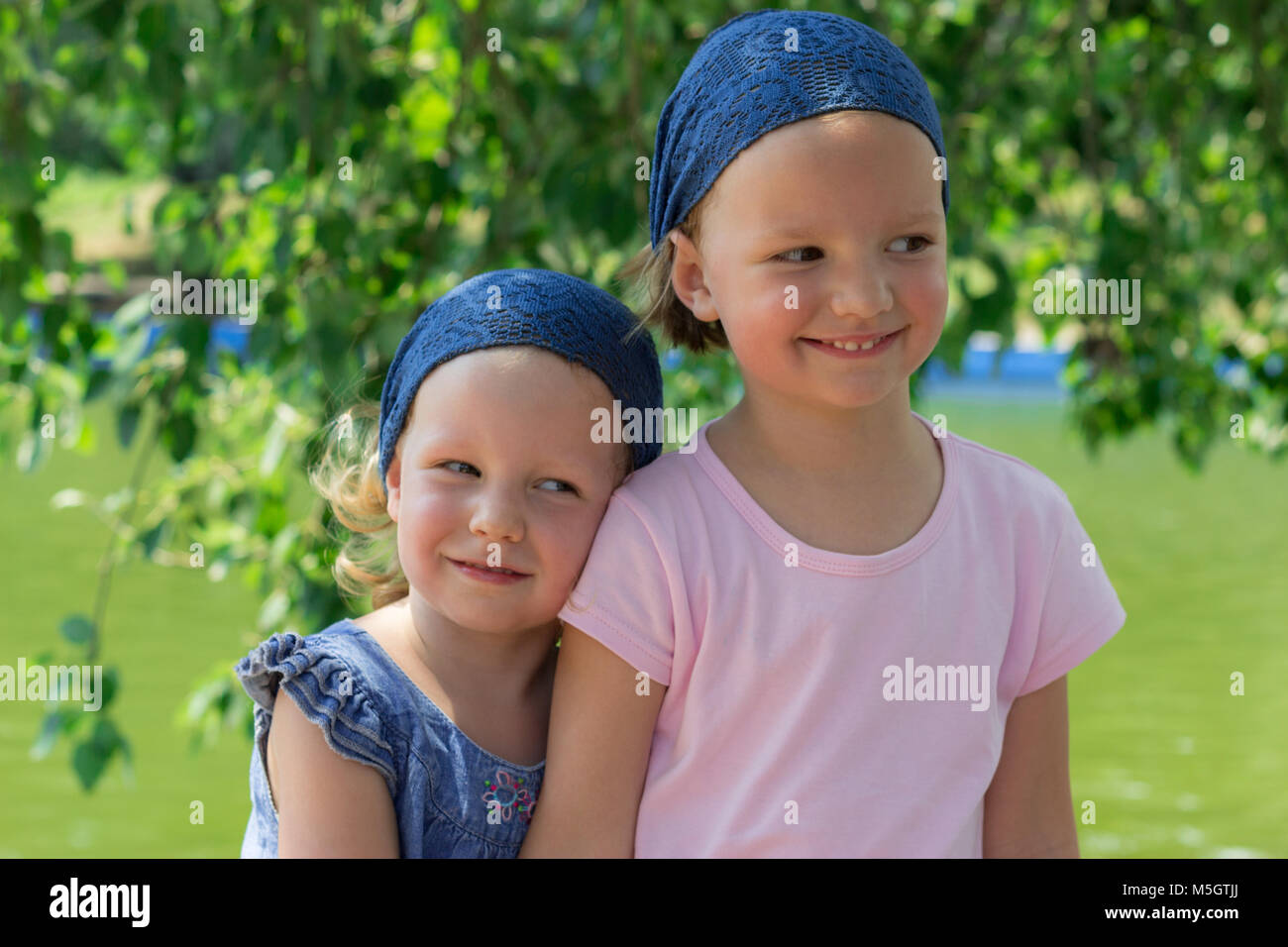 Cute funny little girls (sisters) smile, selective focus Stock Photo ...