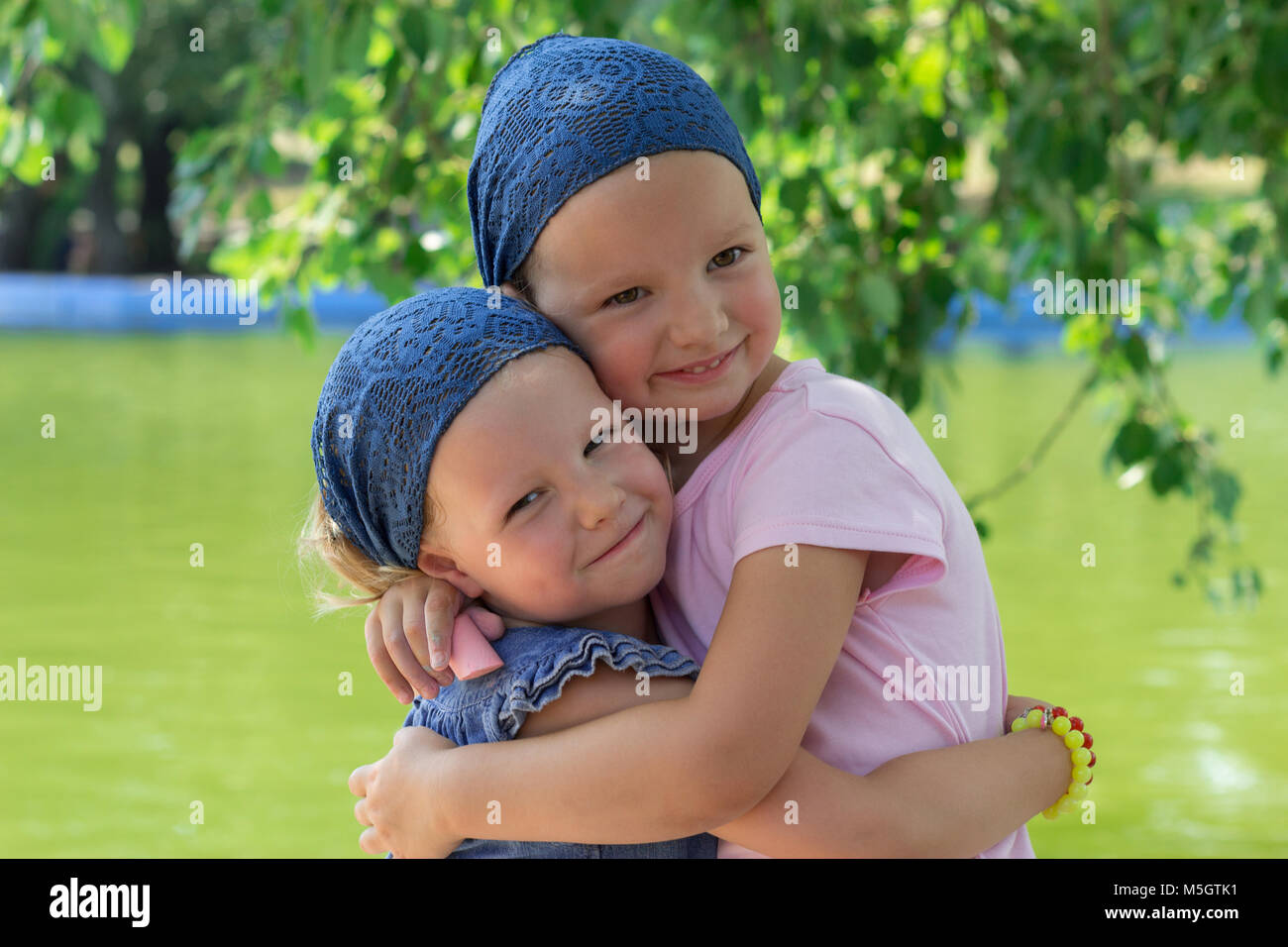 Cute funny little girls (sisters) smile, selective focus Stock Photo ...