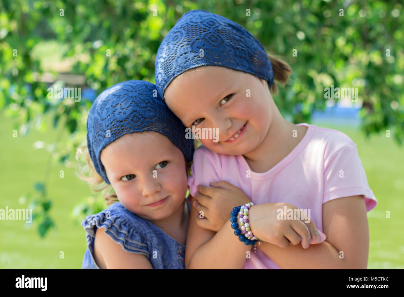 Cute funny little girls (sisters) smile, selective focus Stock Photo ...