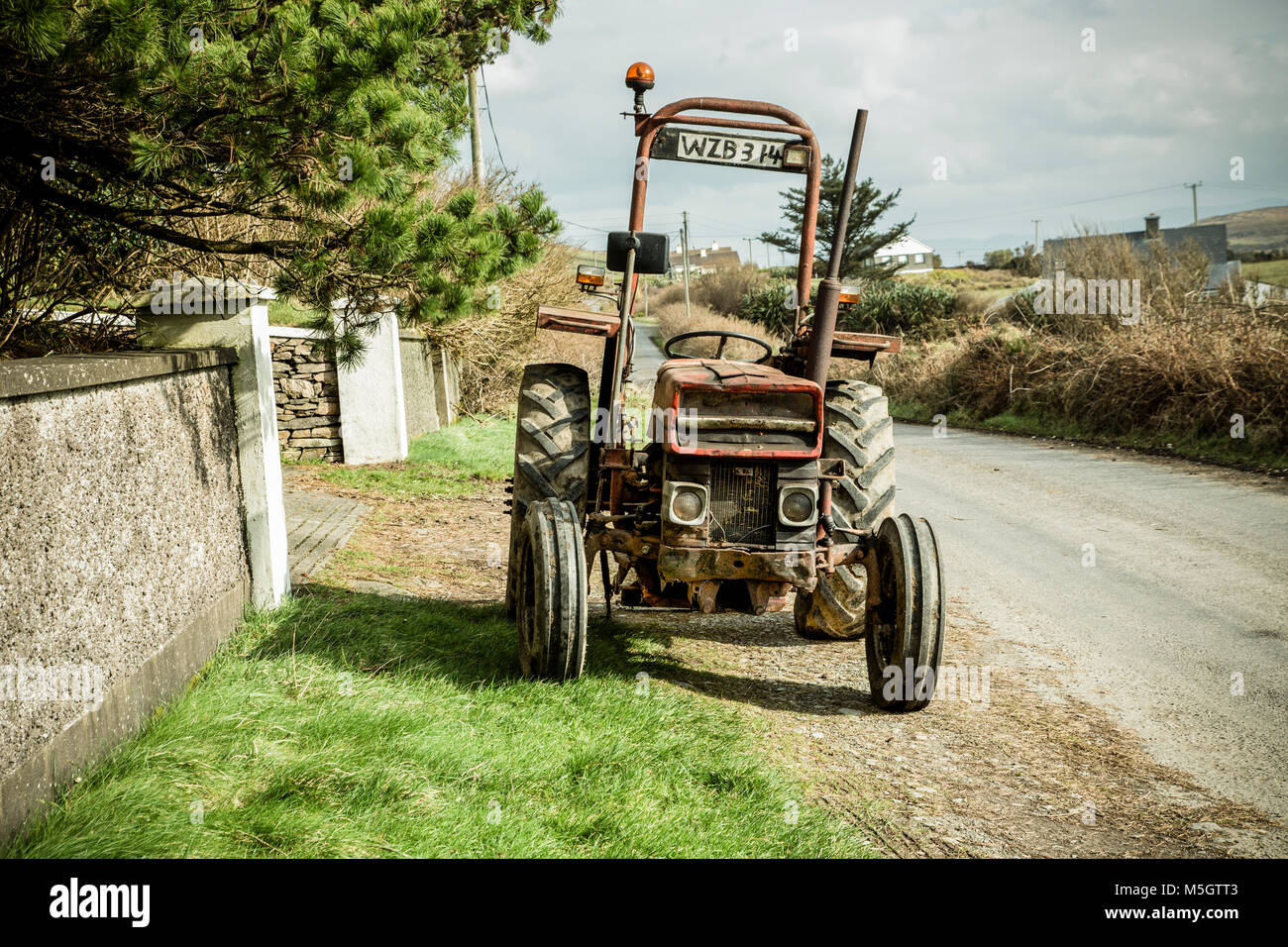 Old Massey Ferguson Tractor on country lane in Ireland Stock Photo - Alamy