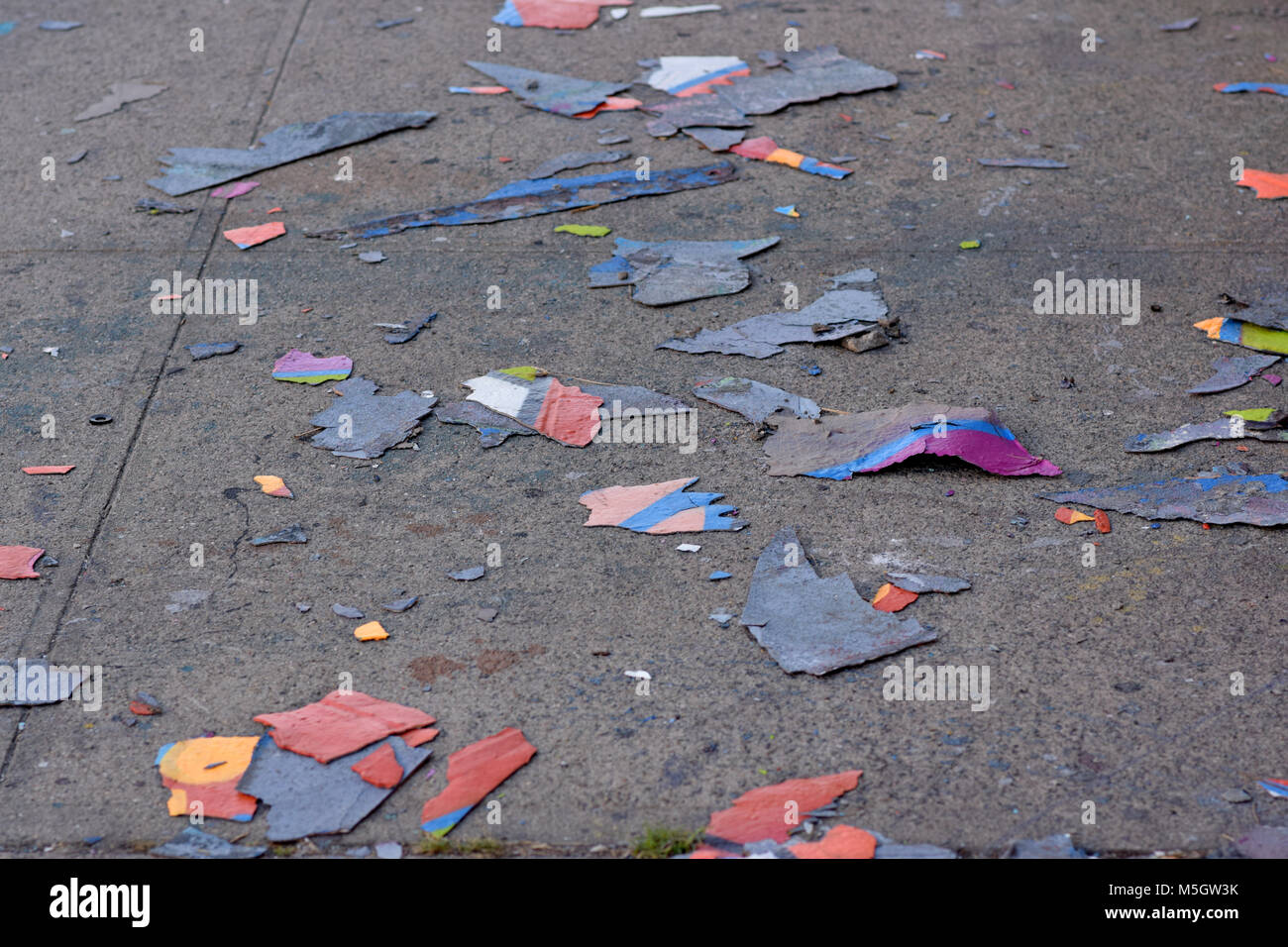 Ripped up paint flakes on the sidewalk Stock Photo - Alamy