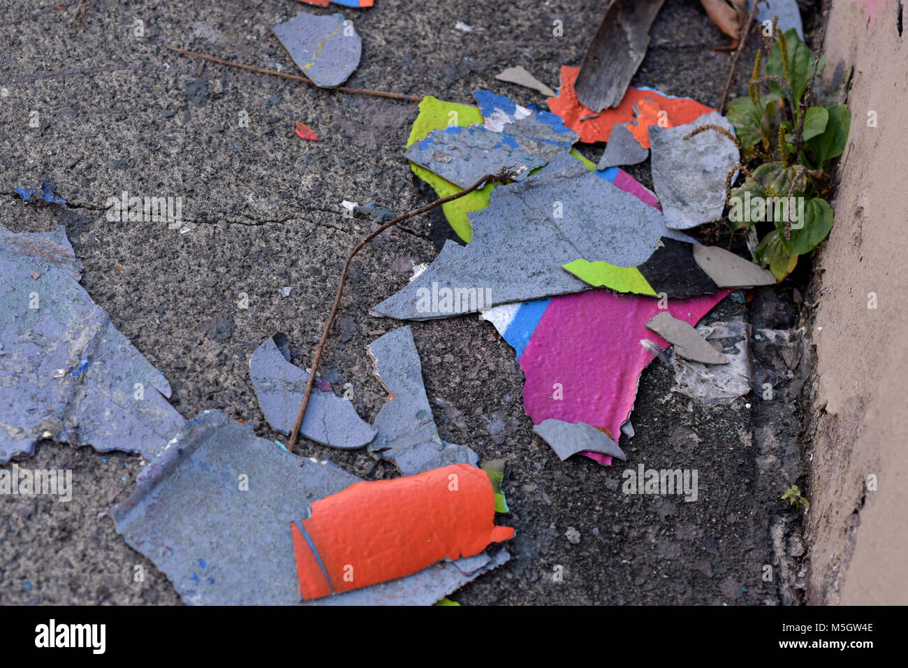 Ripped up paint flakes on the sidewalk Stock Photo - Alamy