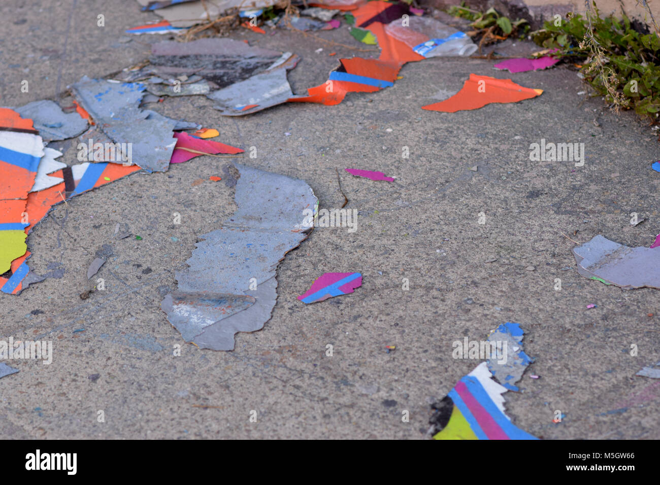 Ripped up paint flakes on the sidewalk Stock Photo - Alamy