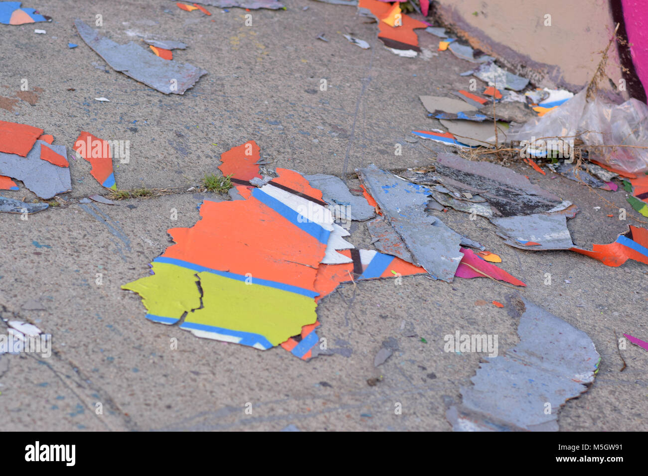 Ripped up paint flakes on the sidewalk Stock Photo - Alamy