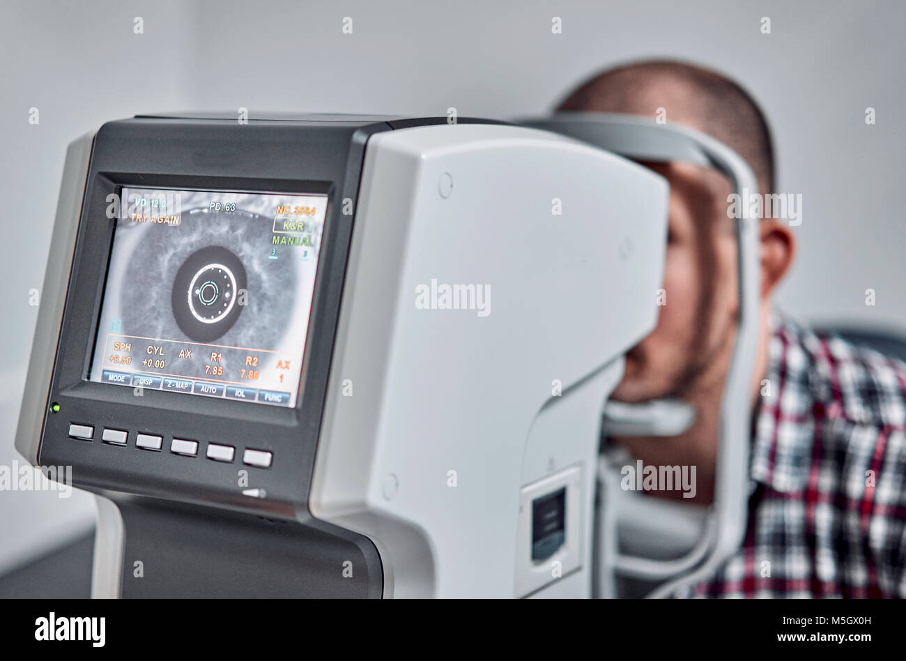 man checks his vision on the machine Stock Photo - Alamy