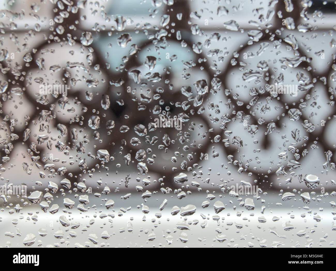 abstract background, glass of a window wet by water drops with the rest ...