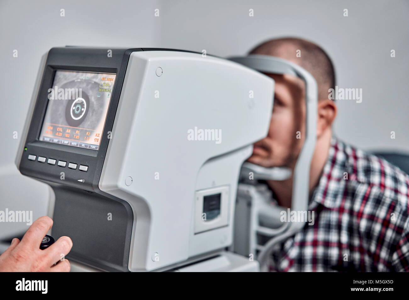 man checks his vision on the machine Stock Photo - Alamy