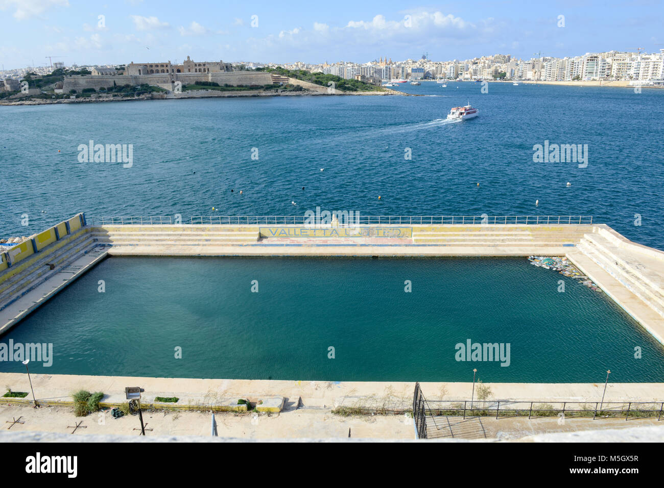 Swimming pool with waste floating in the water at Valletta on Malta ...