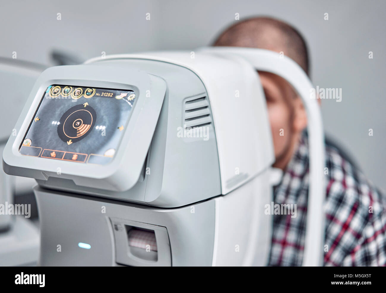 man checks his vision on the machine Stock Photo - Alamy
