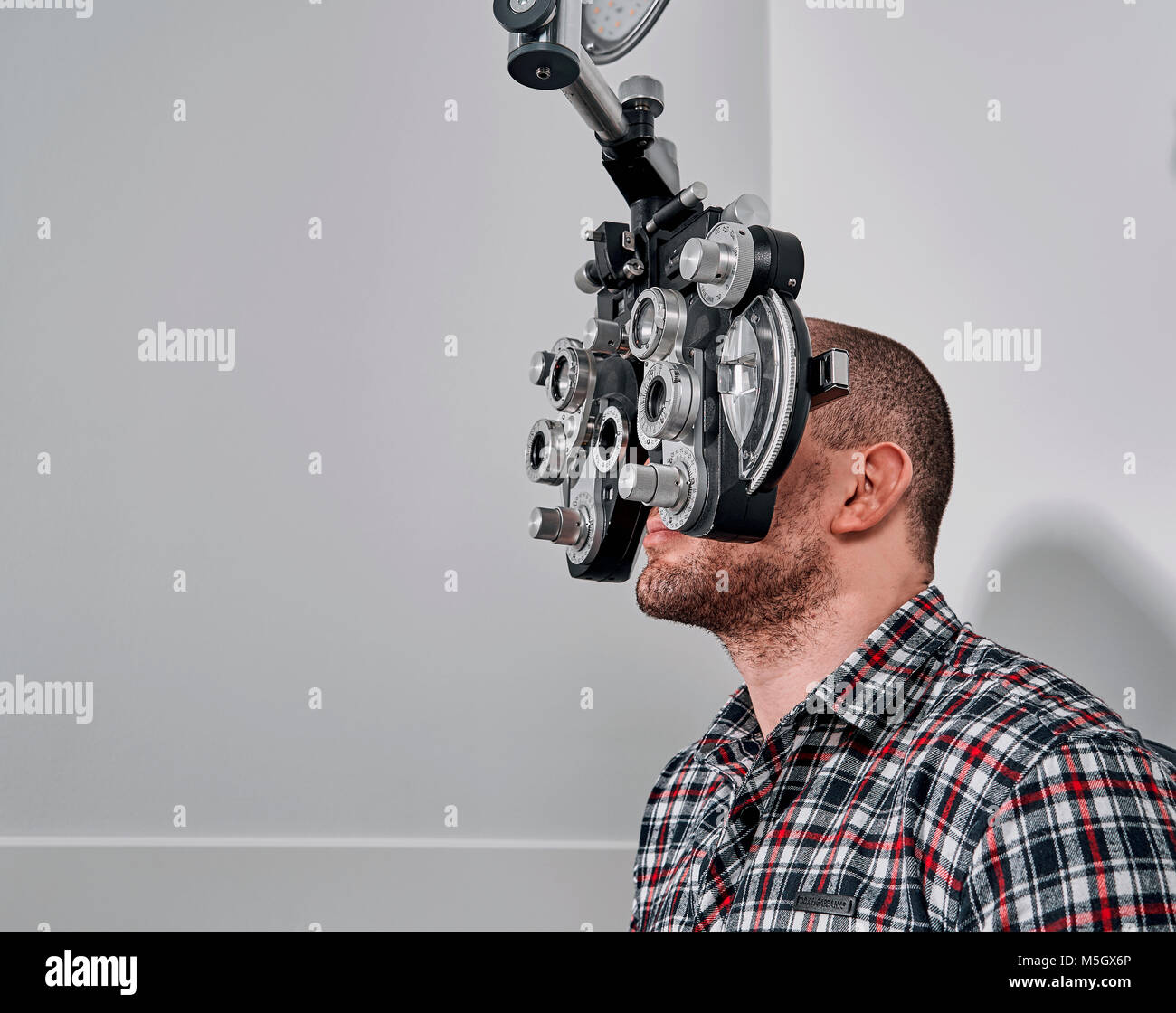man checks his vision on the machine Stock Photo - Alamy