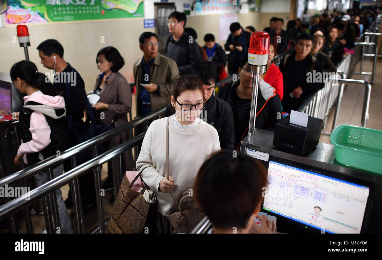 Haikou, China's Hainan Province. 23rd Feb, 2018. Tourists embark at a ...