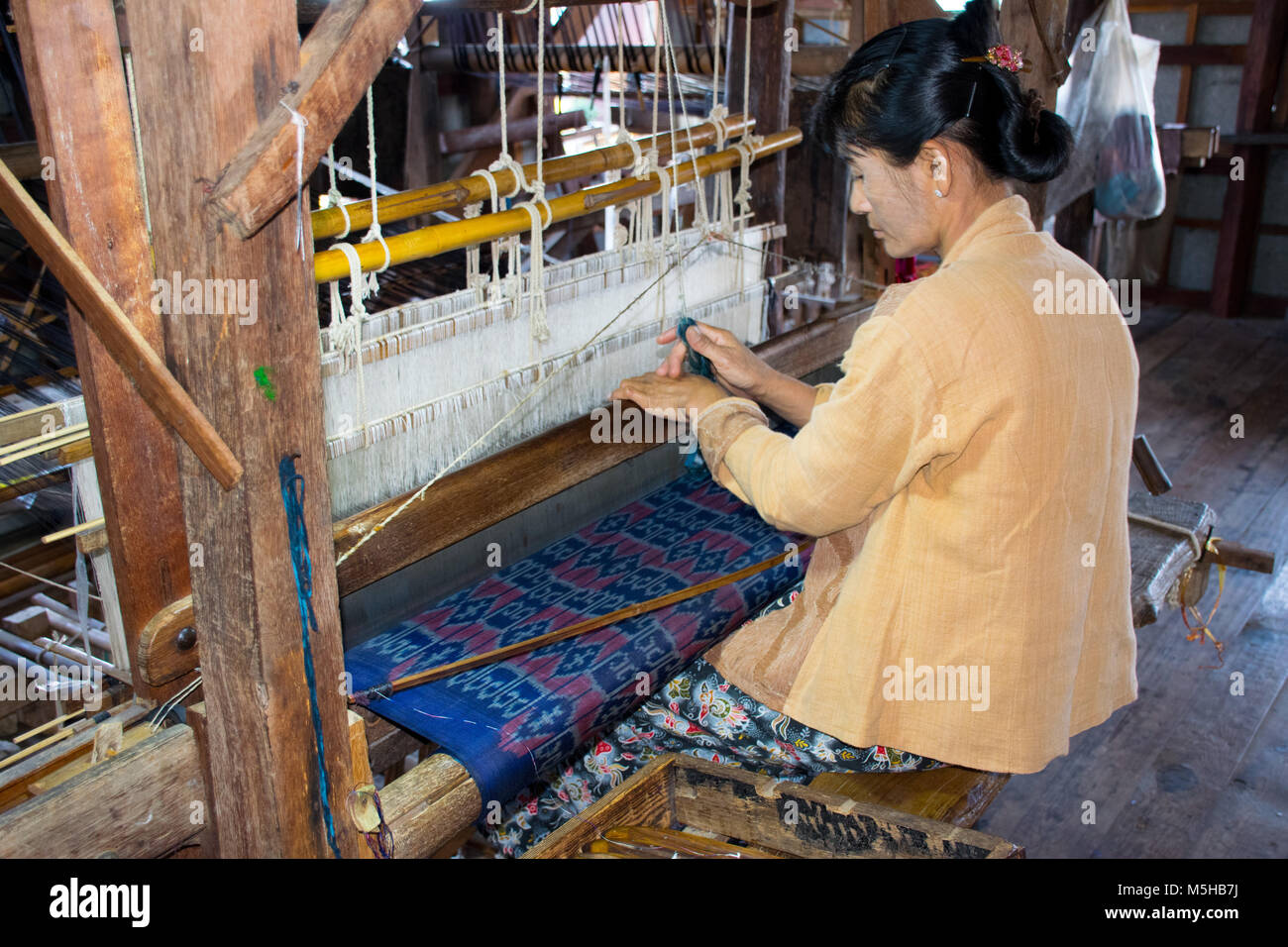 Traditional silk machinist in Inle Lake, Myanmar Stock Photo - Alamy