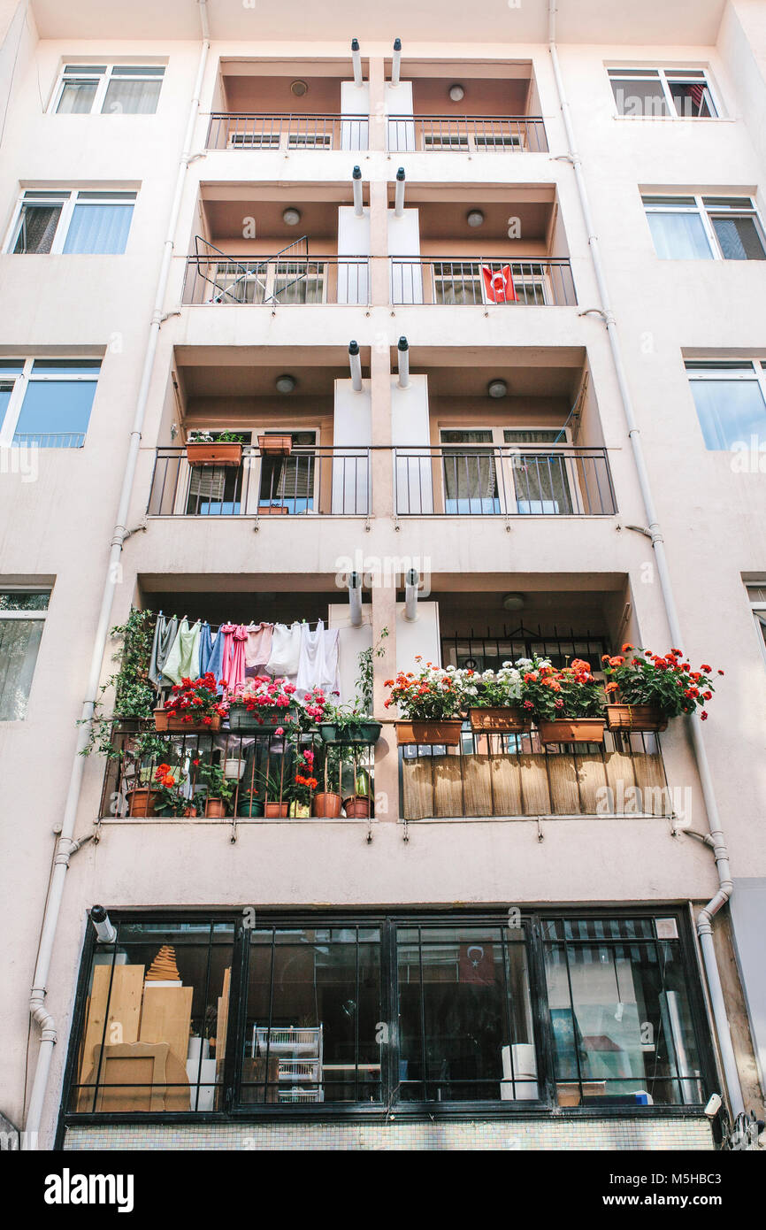 Residential building in Istanbul with balconies decorated with flowers ...