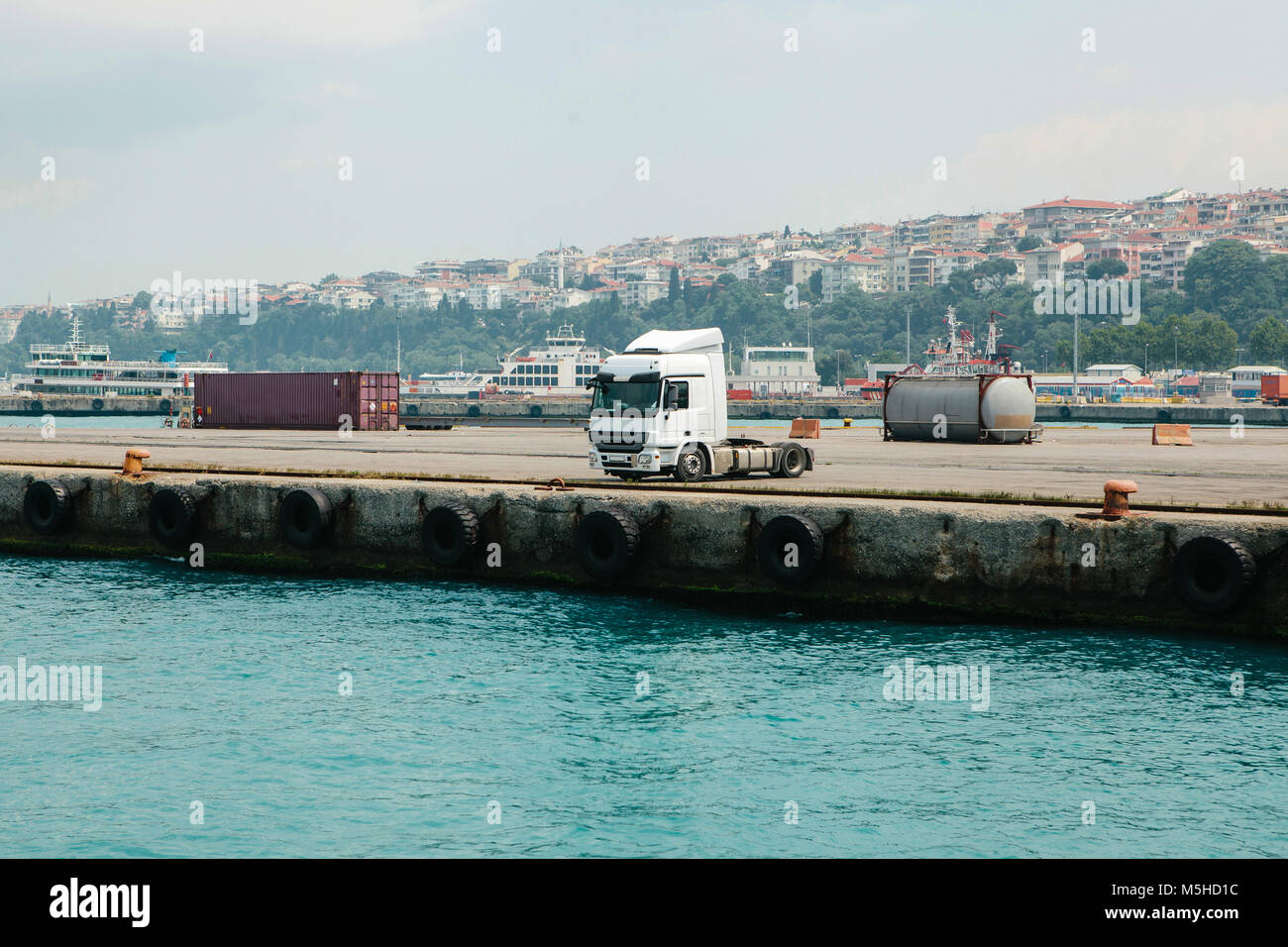 Panoramic view of cargo truck parked at the sea port, city view on the ...