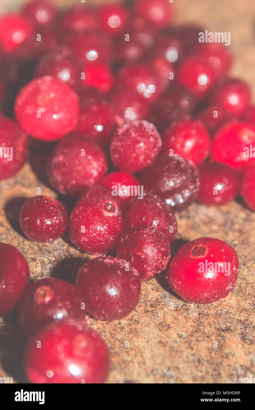 Cold frozen red berry cranberries on the table Stock Photo - Alamy