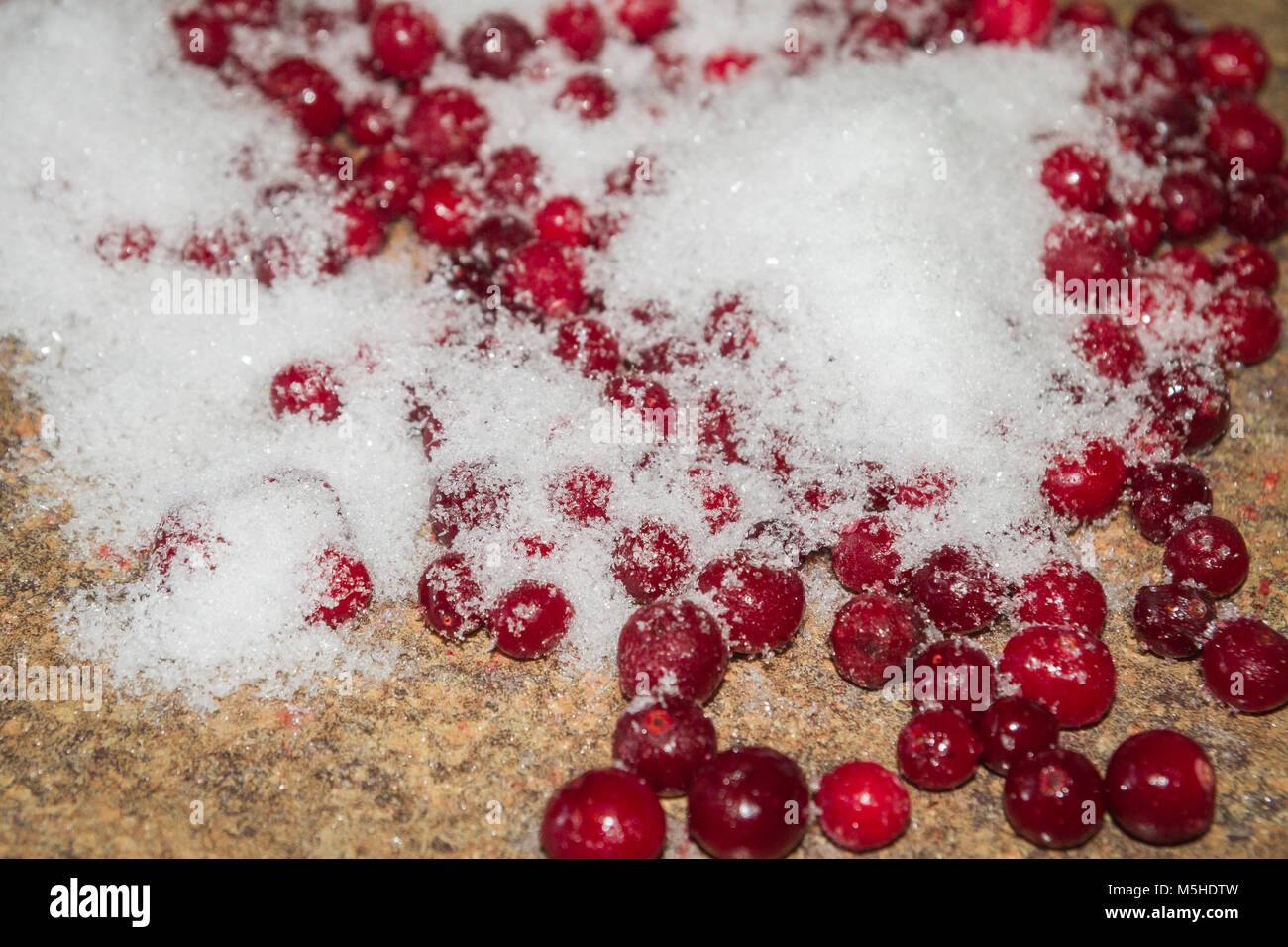 Cold frozen red berry cranberries on the table Stock Photo - Alamy