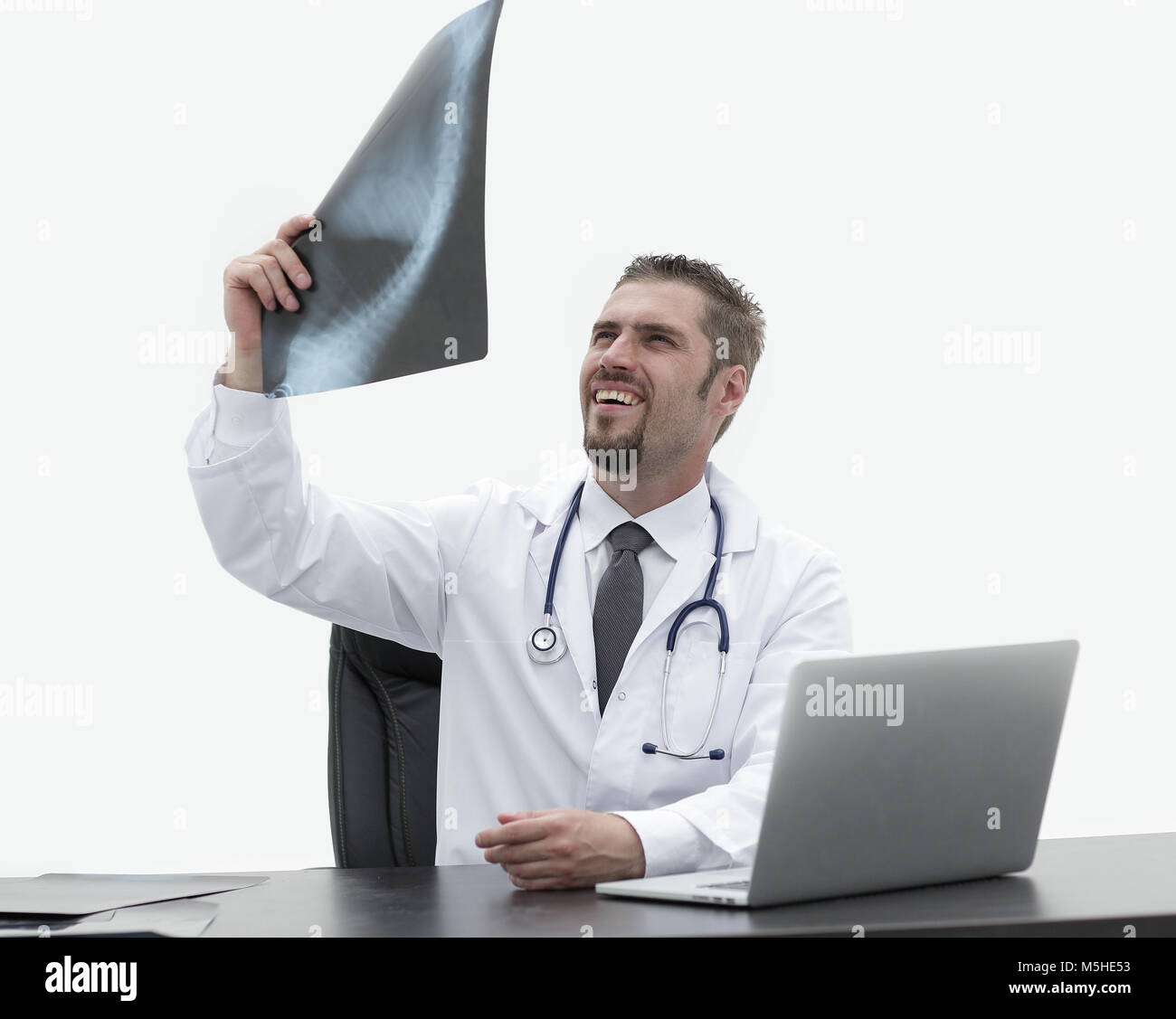 doctor examines an x-ray,sitting behind a Desk Stock Photo - Alamy