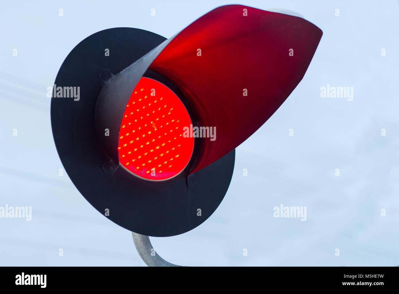 Traffic light shows red signal on railway. Red light Stock Photo - Alamy