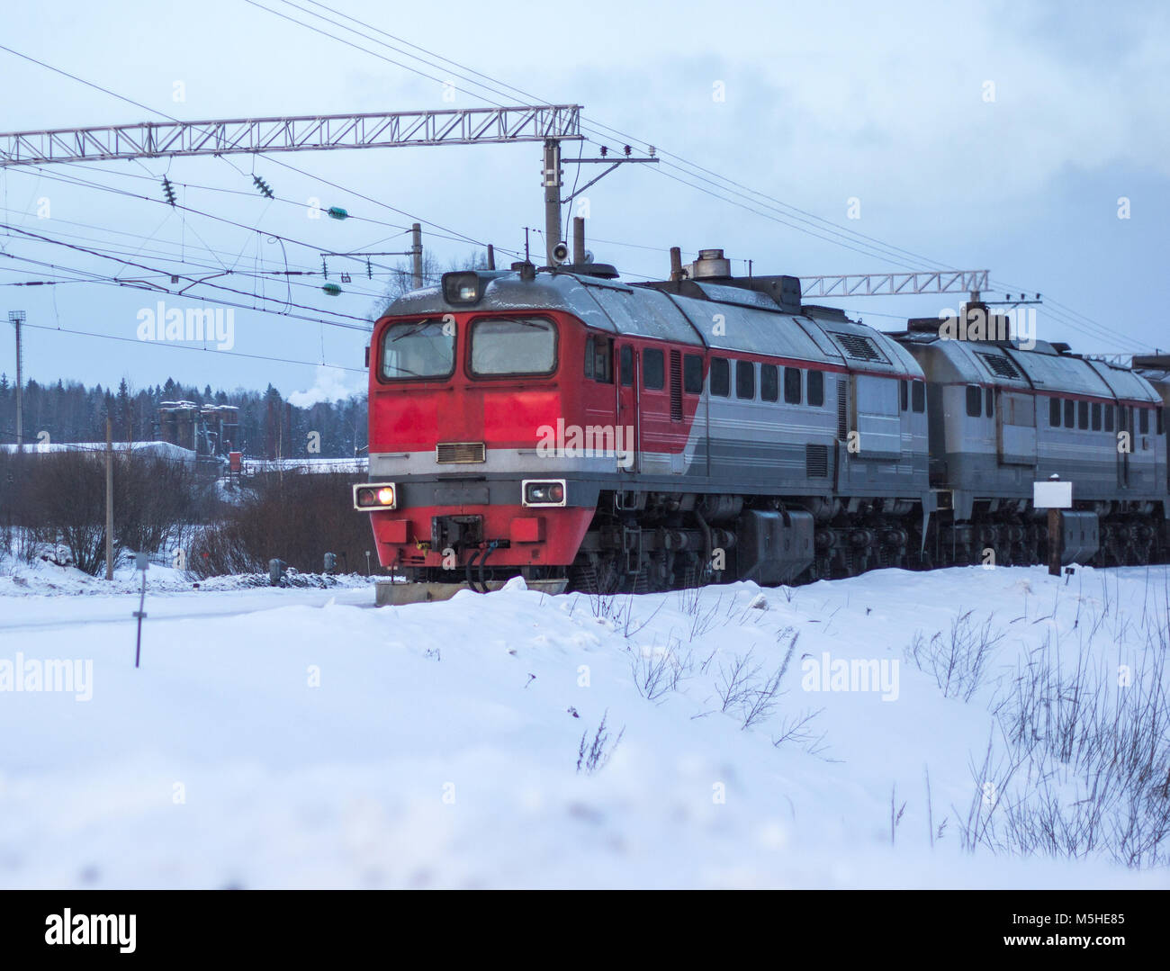 Freight train locomotive carrying with cargo on daylight Stock Photo ...