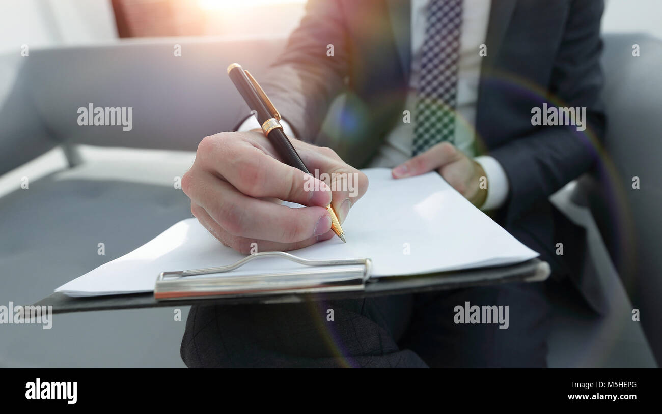 Closeup of human hand writing on a paper Stock Photo - Alamy
