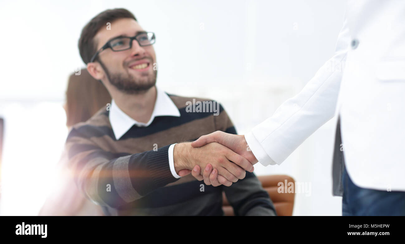 handshake between colleagues in the workplace.photo with copy space ...