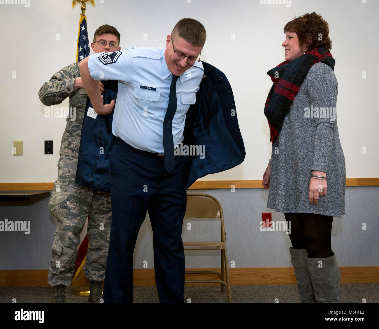 U.S. Air Force 2nd Lt. Trevor Foley helps his father, Chief Master Sgt ...