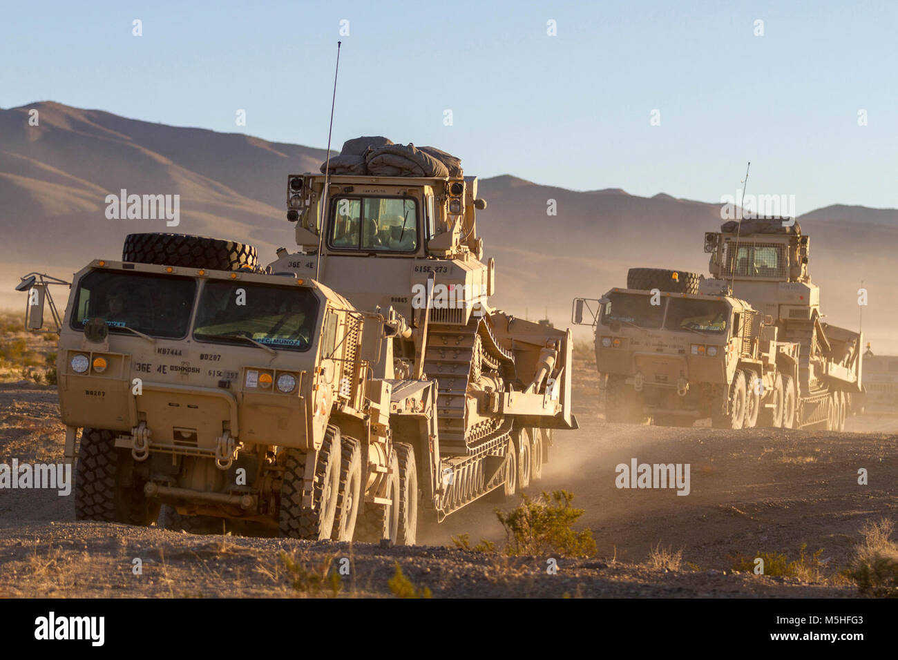 A pair of Medium Support Vehicle Systems move heavy equipment for 299th ...