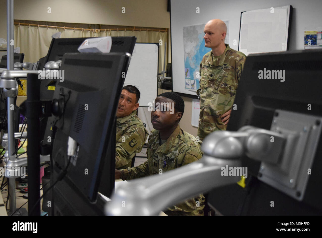 Capt. Adrian Hill (right) and Sgt. 1st Class Jose Arellano (far left ...