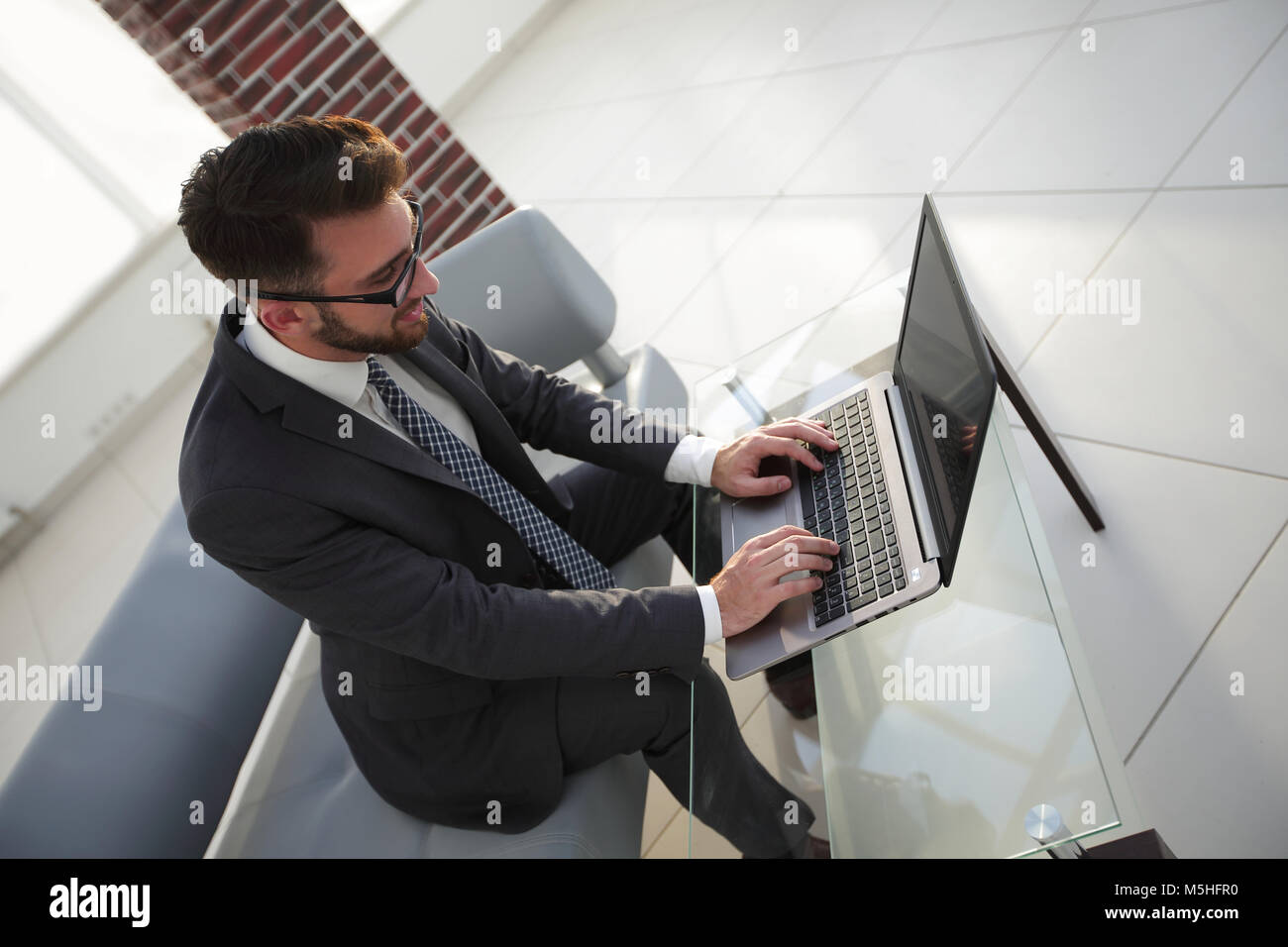 Concentrated professional IT developer with laptop Stock Photo - Alamy