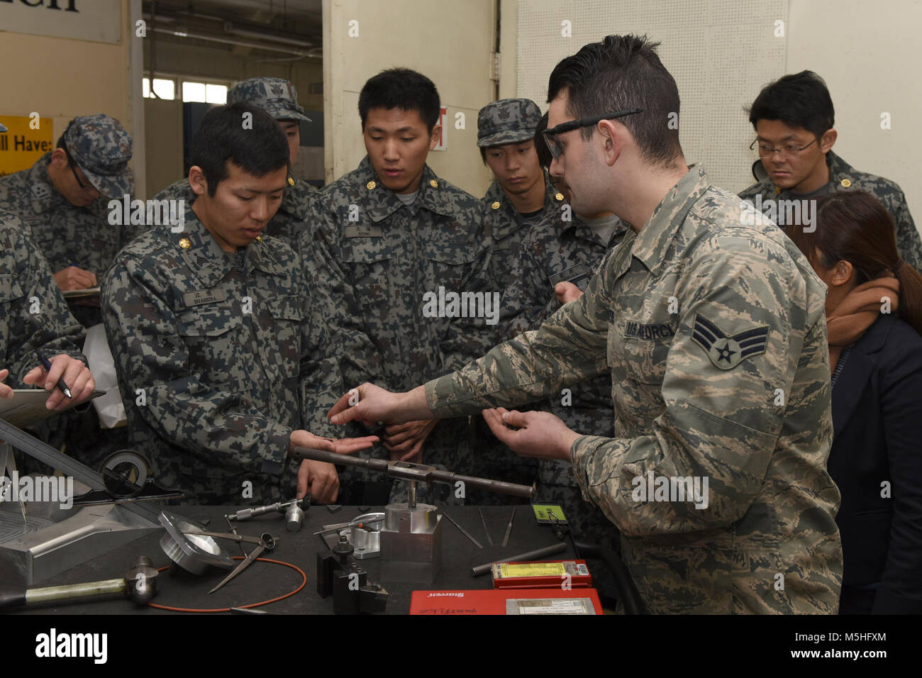U.S. Air Force Senior Airman David Petrich, 374th Maintenance Squadron aircraft metals ...
