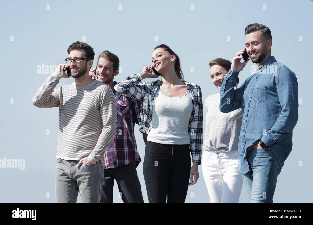group of young people with smartphones Stock Photo - Alamy