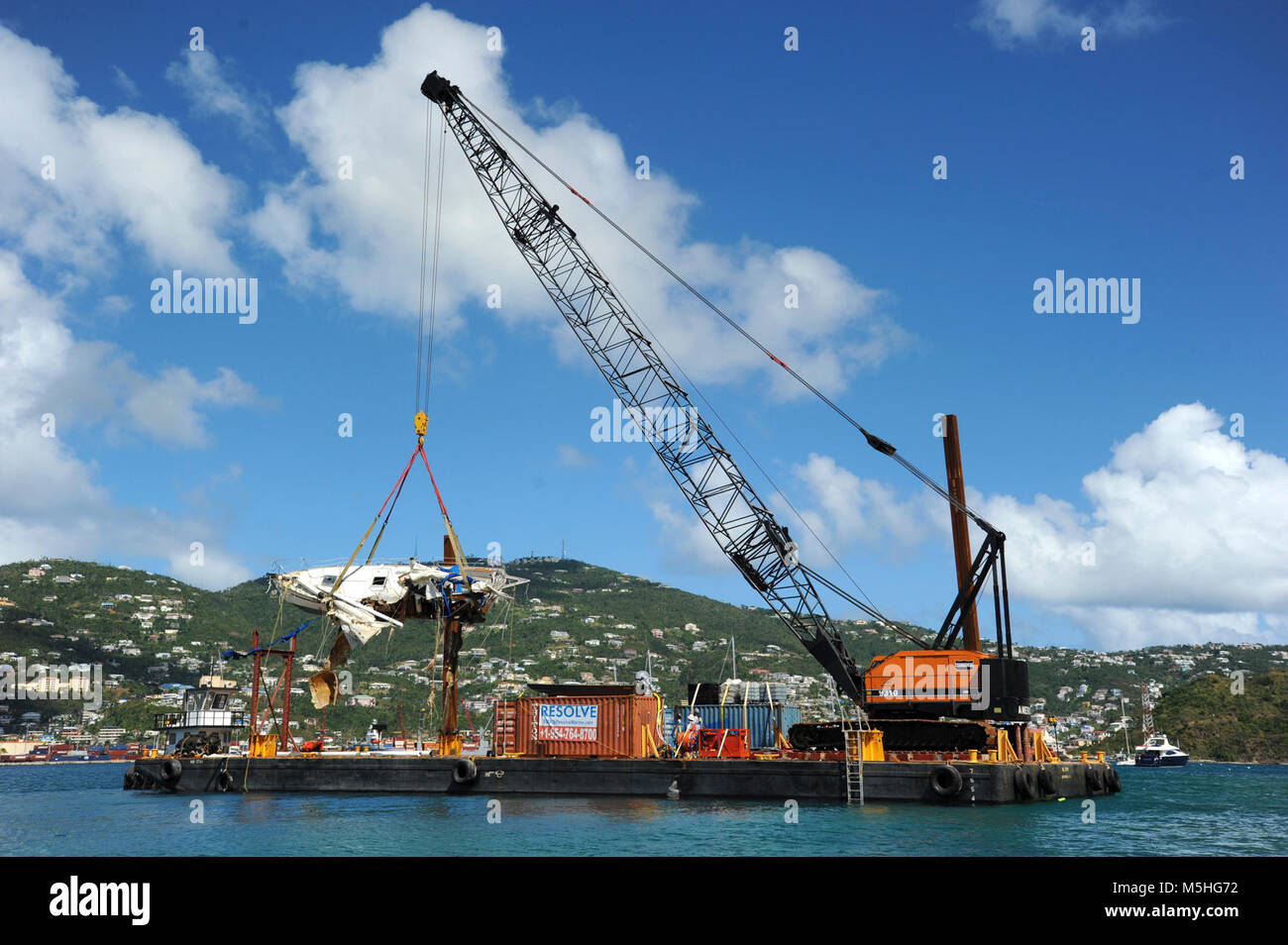 Coast Guard members oversee the operations of Resolve Marine Group, a ...