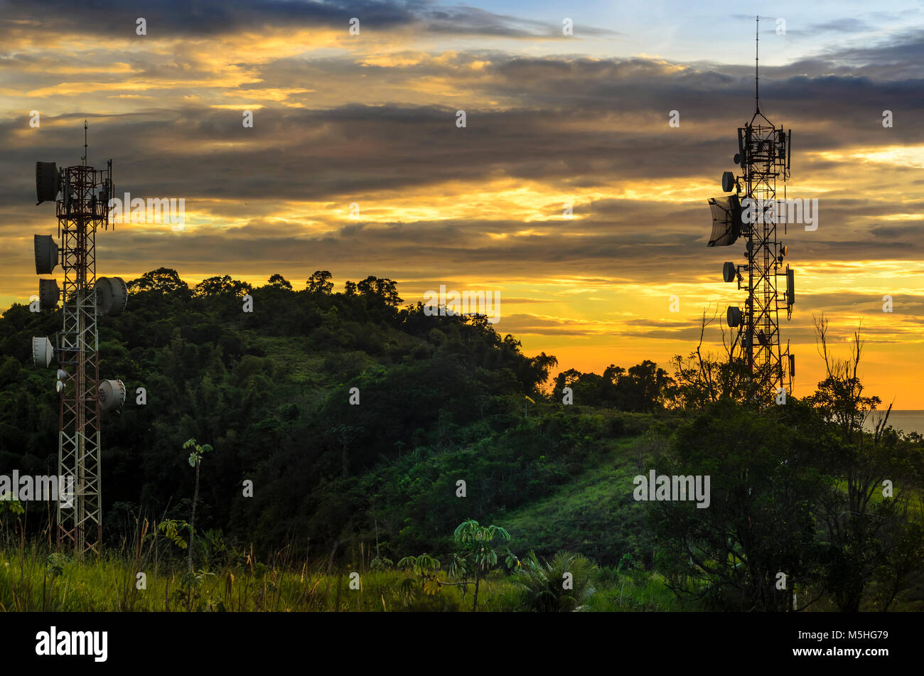 Telecommunications and radio towers with sunset sky in background on ...