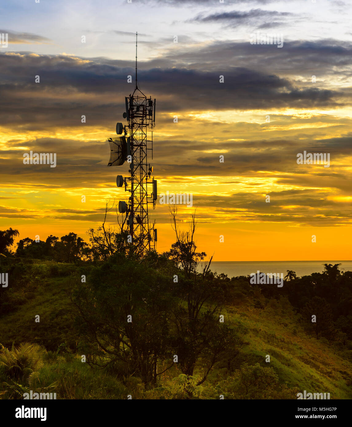 Telecommunications and radio towers with sunset sky in background on ...