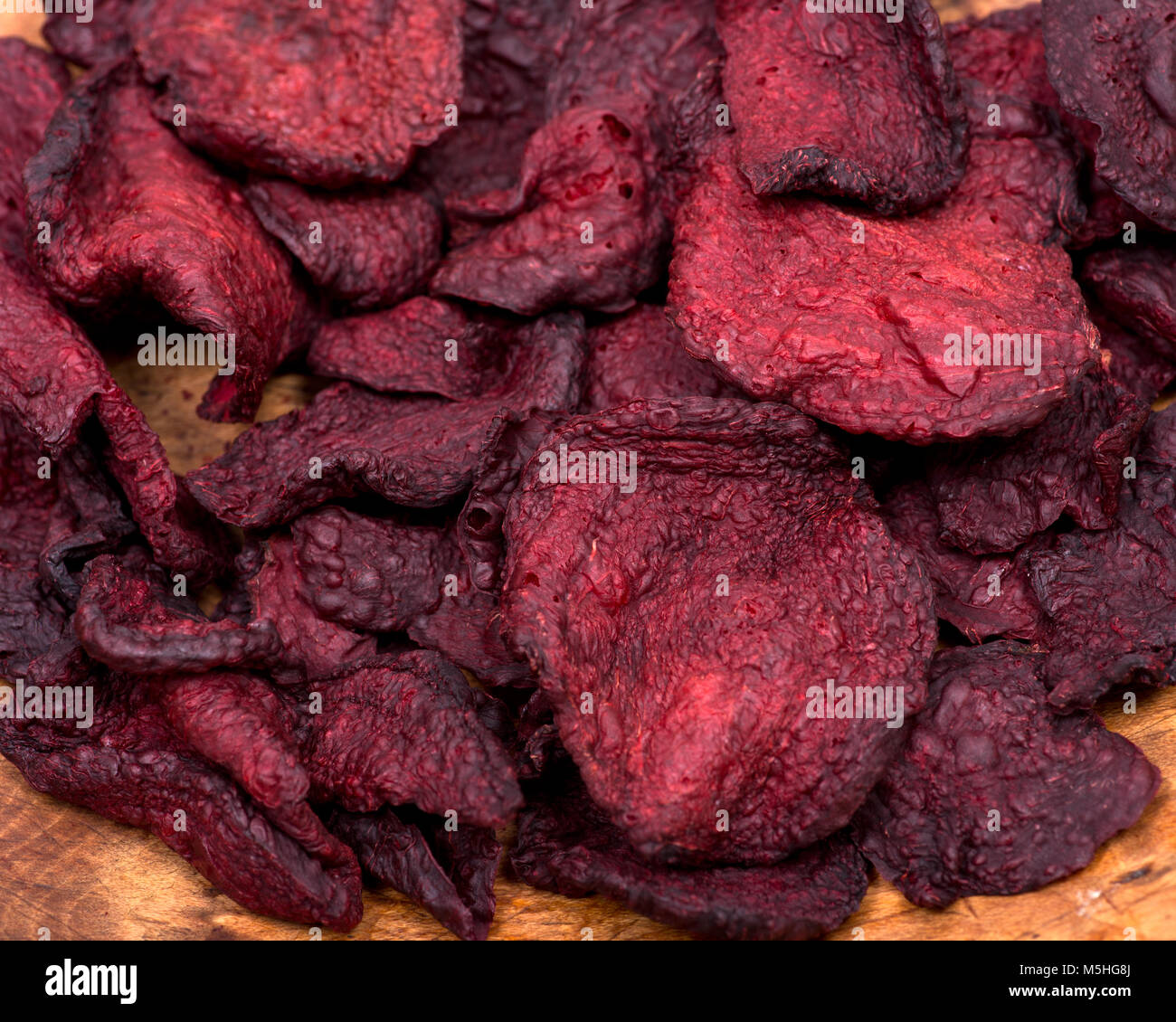 Organic dehydrated red beets in vintage wooden bowl Stock Photo - Alamy