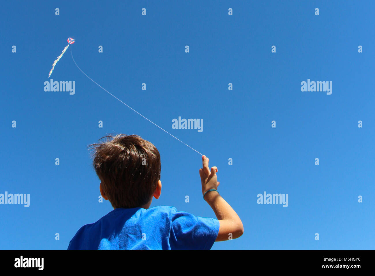 Boy Flying Kite Stock Photo - Alamy