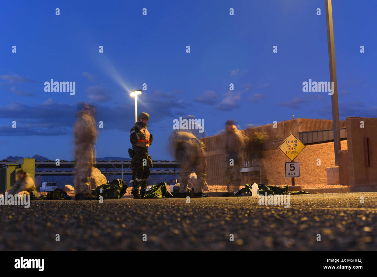 U.S. Airmen don mission-oriented protective posture gear during the ...