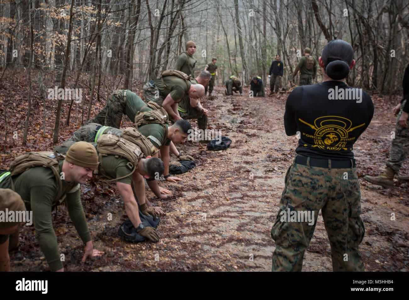 U.S. Marine Corps Staff Sgt. Melissa Marnell (right) supervises the ...