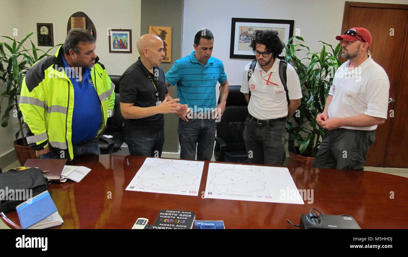 Members of USACE, FEMA, and the municipality of Aibonito staff discuss ...