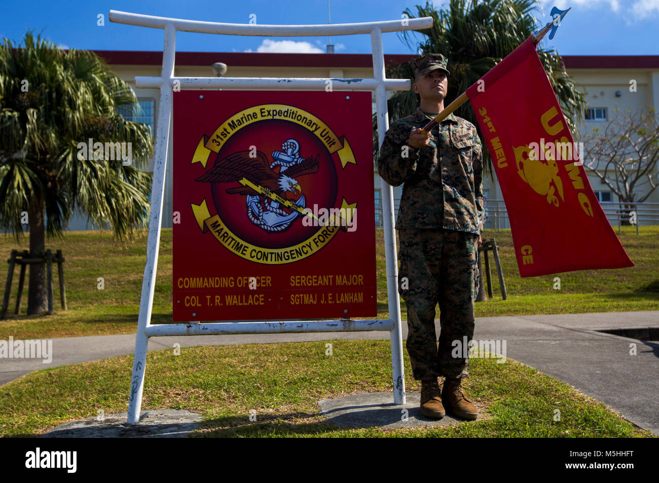 Cpl. Nicholas Rojas holds the guidon of the 31st Marine Expeditionary ...