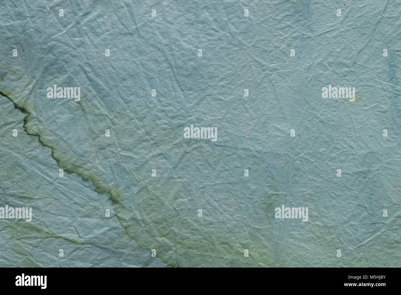 blue color painted creased tissuse paper background texture Stock Photo ...