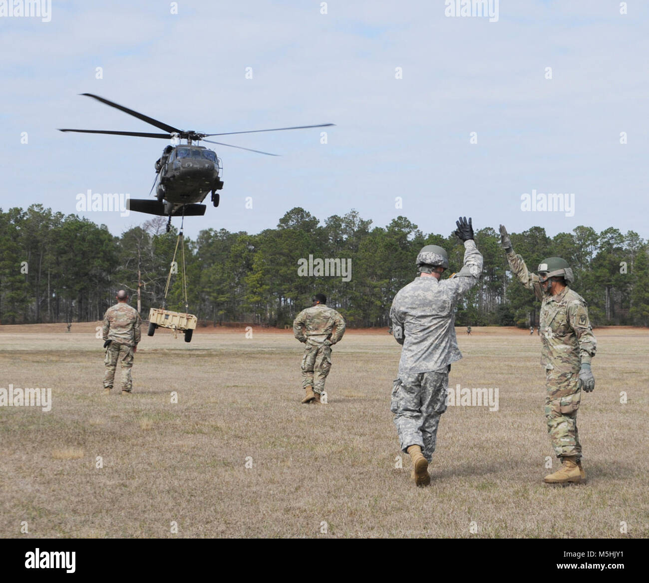 Two Air Assault students give a high five after a successful sling load ...