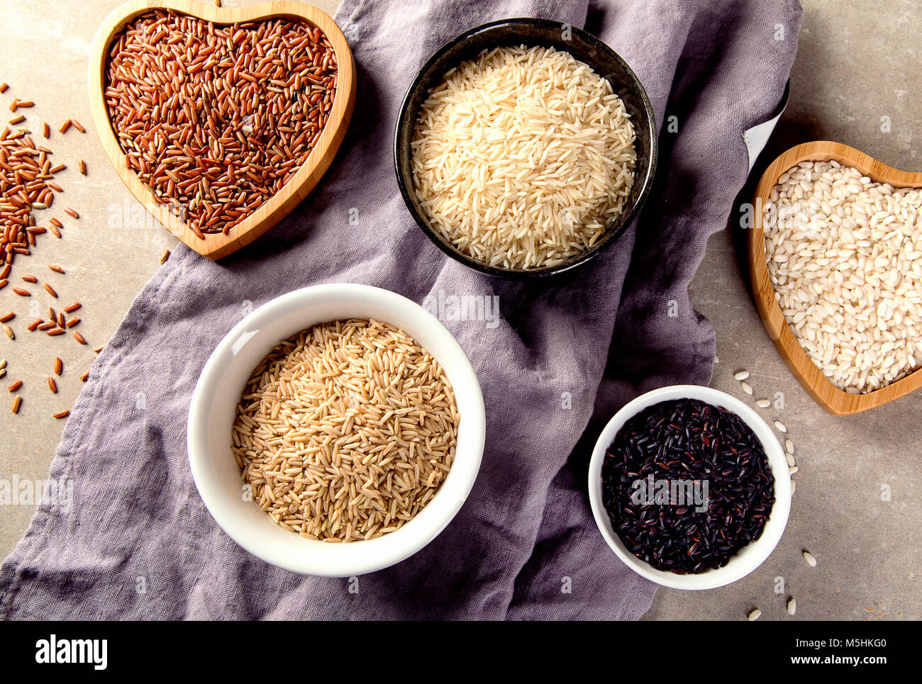 Different kinds of rice grains. Top view Stock Photo - Alamy