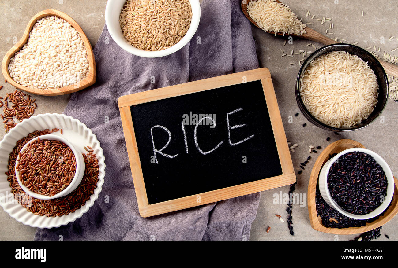 Different kinds of rice grains. Top view Stock Photo - Alamy