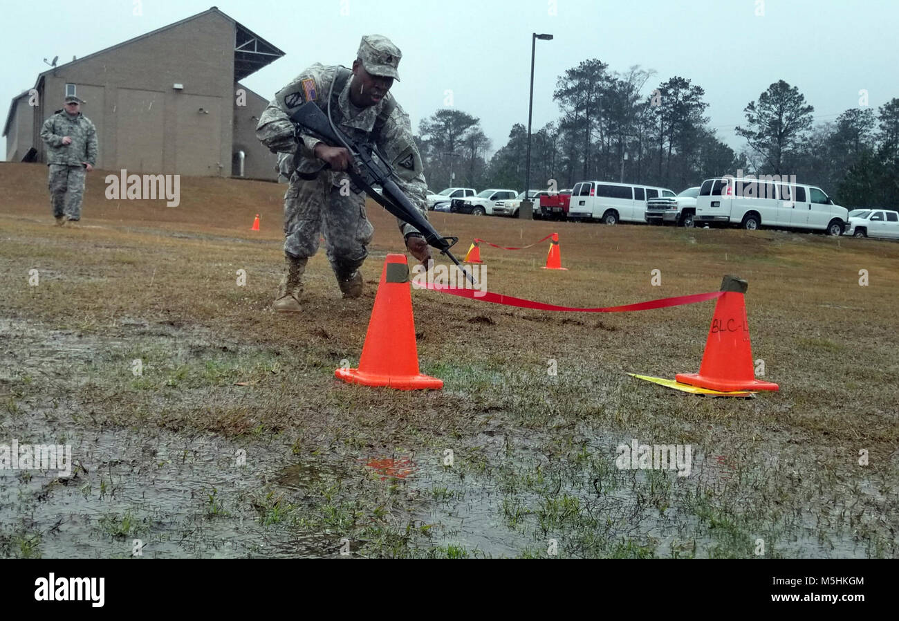 Staff Sgt. Timothy Hudson, from the Camp McCain Training Center, moves ...