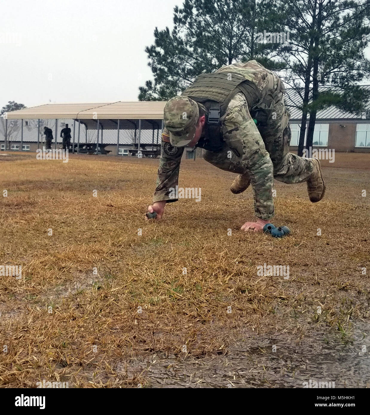 Sgt. Dustin Hines, with the 154th Regional Training Institute, hurries ...