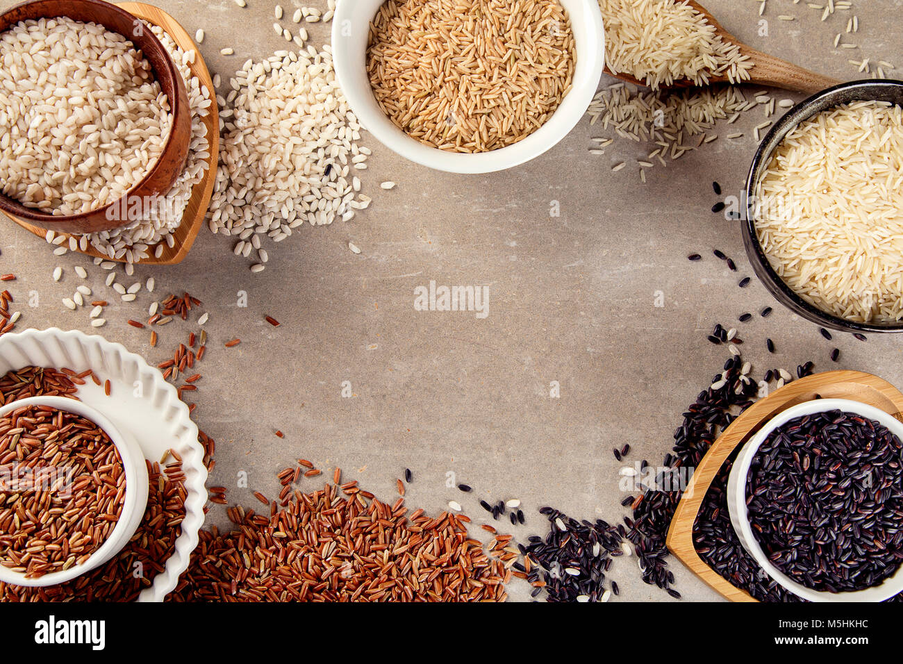 Different kinds of rice grains. Top view Stock Photo - Alamy