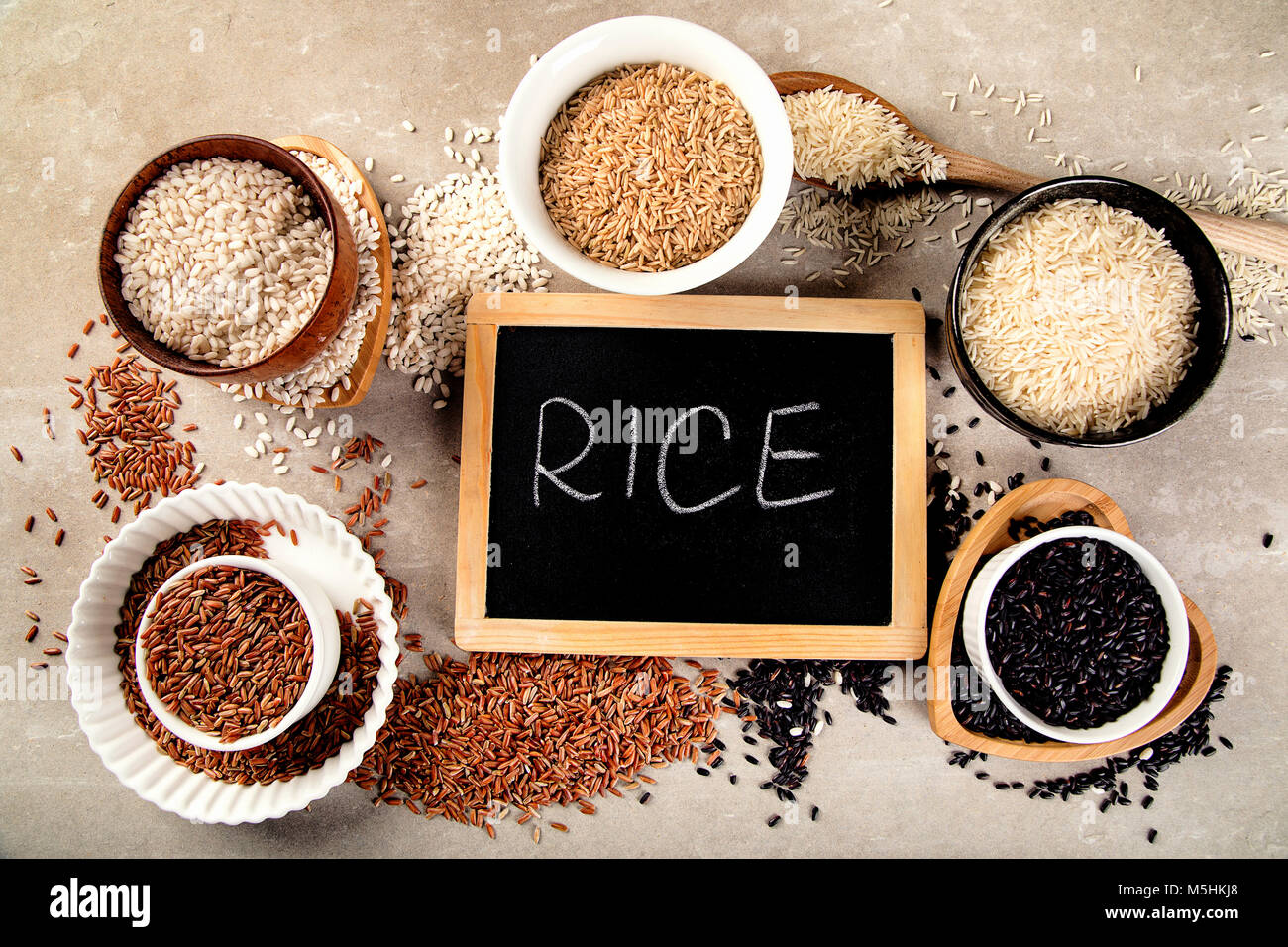 Different kinds of rice grains. Top view Stock Photo - Alamy