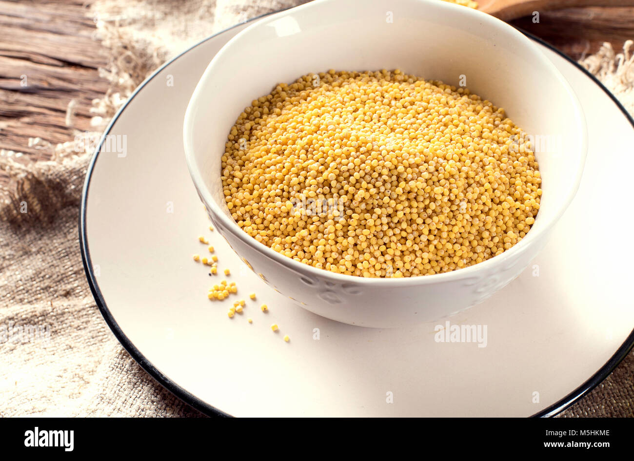 Organic millet seeds on rustic wooden table. View from above Stock ...